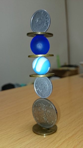 Japanese Man Has Conquered The Art Of Gravity-Defying Coin Stacking