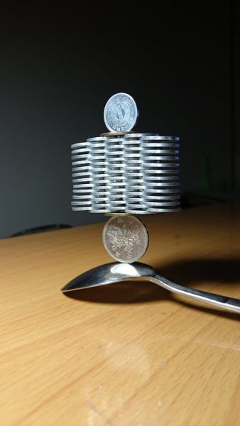 Japanese Man Has Conquered The Art Of Gravity-Defying Coin Stacking