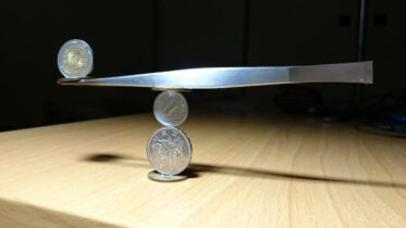 Japanese Man Has Conquered The Art Of Gravity-Defying Coin Stacking