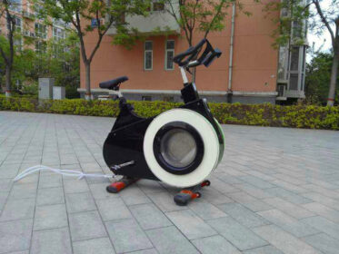 This Exercise Bike Has A Built-In Washing Machine So You Can Cycle Your ...