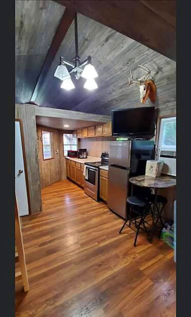 The 'We-Shed' Is A Pair Of His And Her Sheds Conjoined By A Deck