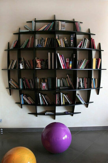 These 3D Sphere Bookshelves Look Like They're Emerging From Within The Wall