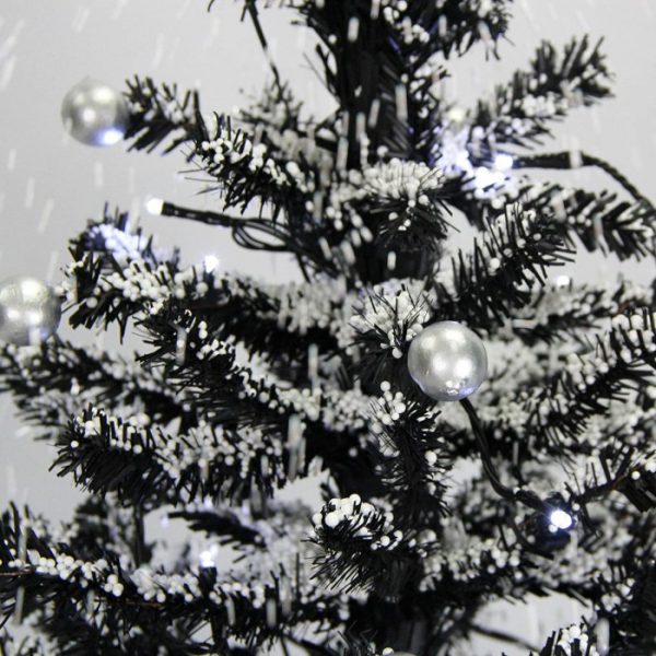 This "Snowing" Christmas Tree Plays Festive Music As Well