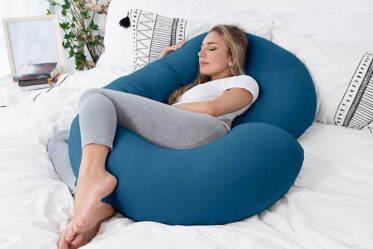 This C-Shaped Pregnancy Pillow Supports Your Bump While You Sleep