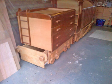 This Wooden Train Crib Comes With A 'Coal Car' With Drawers And Diaper ...