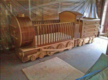 This Wooden Train Crib Comes With A 'Coal Car' With Drawers And Diaper ...