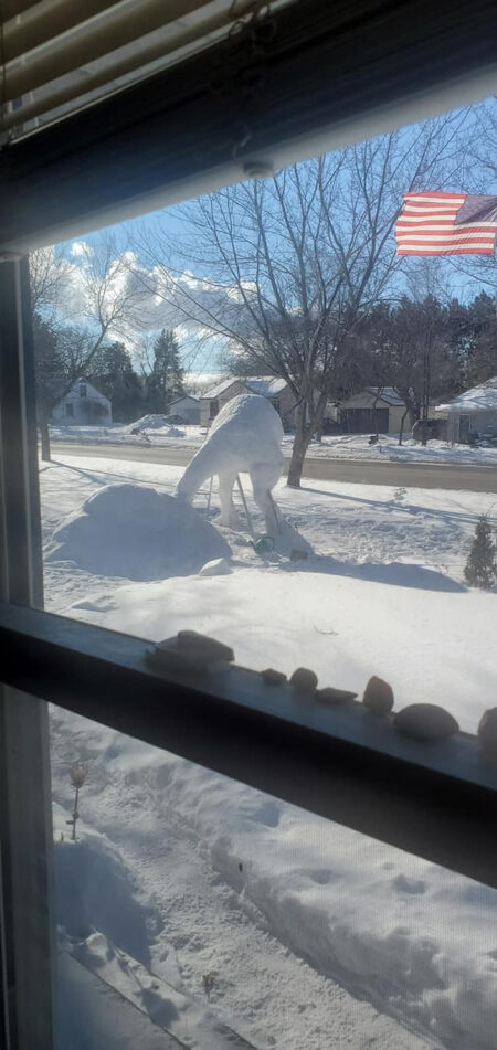 Man Builds Giant 12ft T-Rex Out Of Snow In His Front Yard
